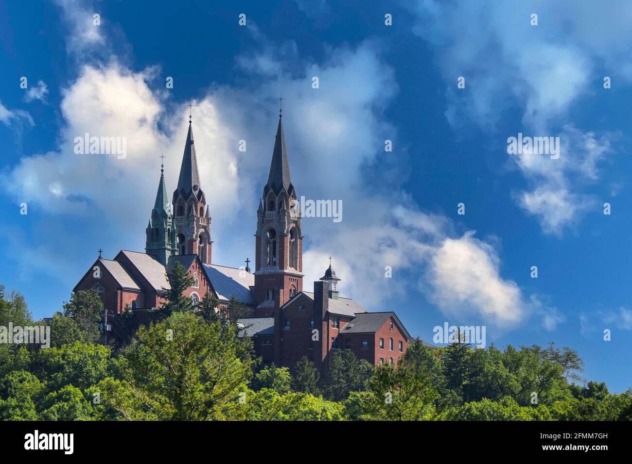 old historic church with twin steeples on a high hill mountain with ...