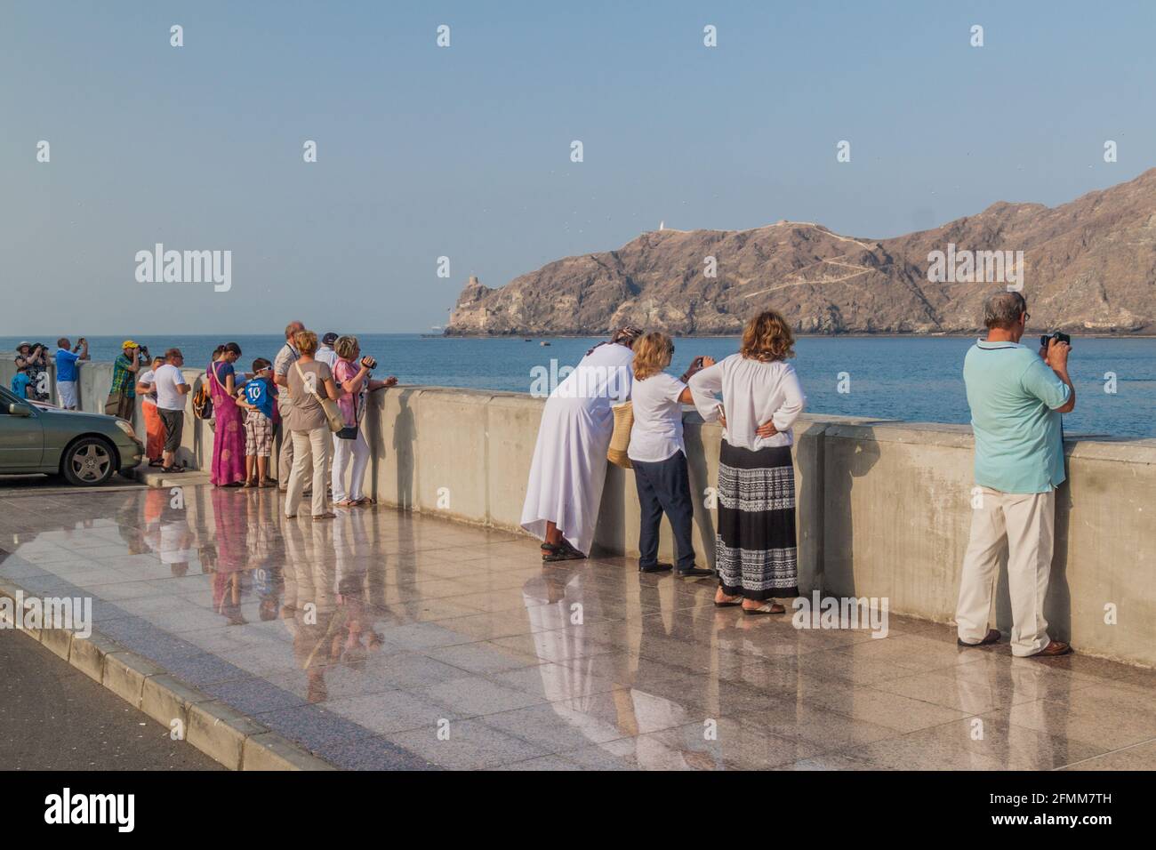 MUSCAT, OMAN - FEBRUARY 22, 2017: Tourists on a sea coast in Muscat ...