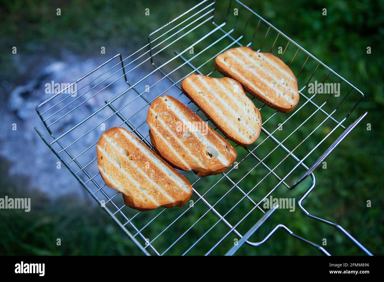 Grilled toast on the wire rack. Outdoor recreation. Bonfire, grill ...