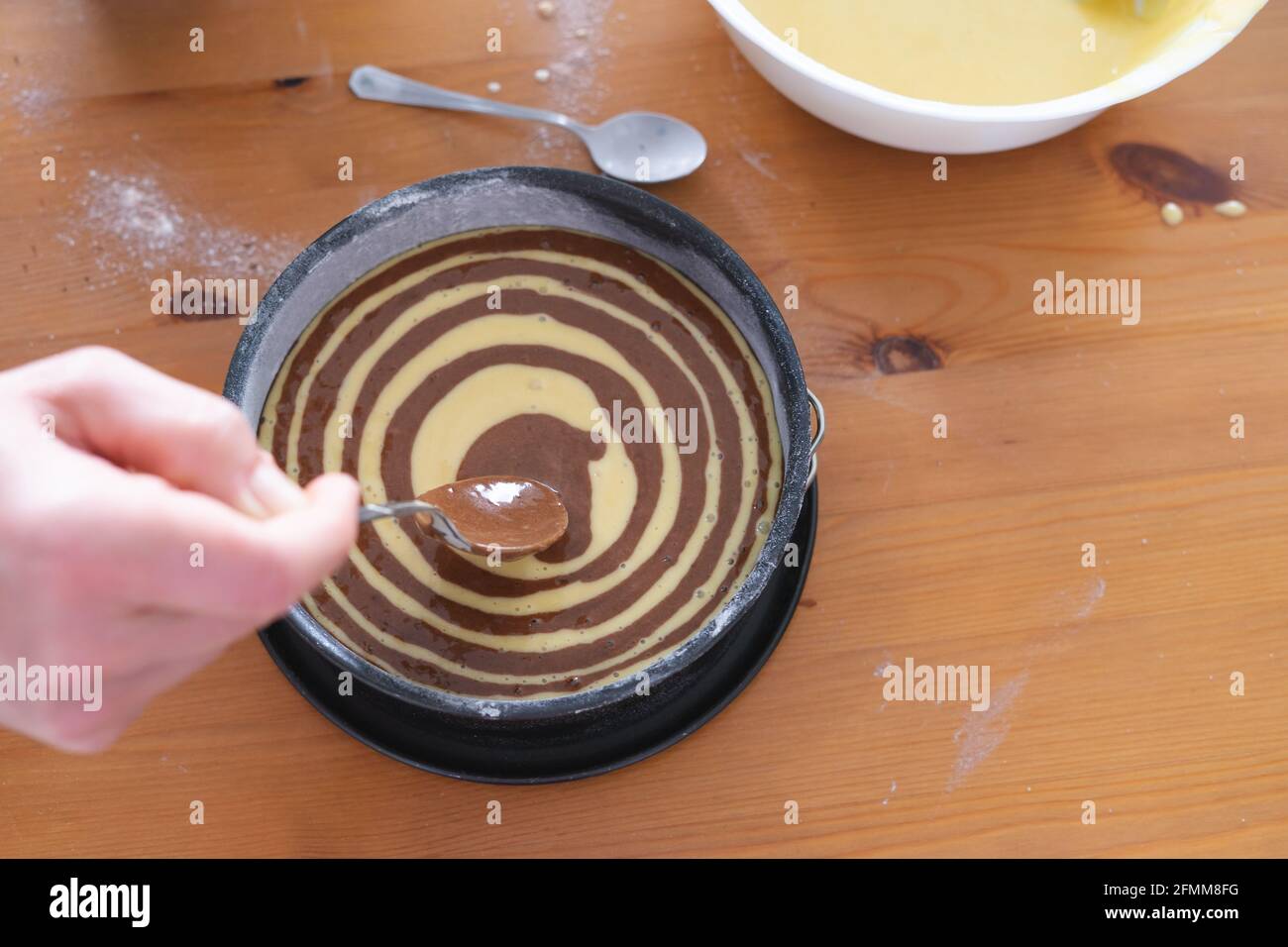 Marble sponge cake elaboration process. Copy space. Pastry Stock Photo ...