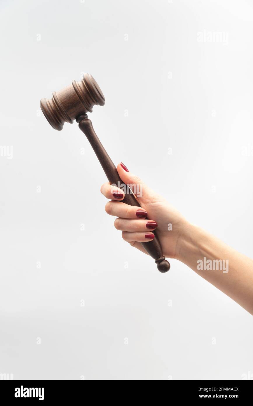 Judge gavel in female hand on white background. Woman judge concept ...