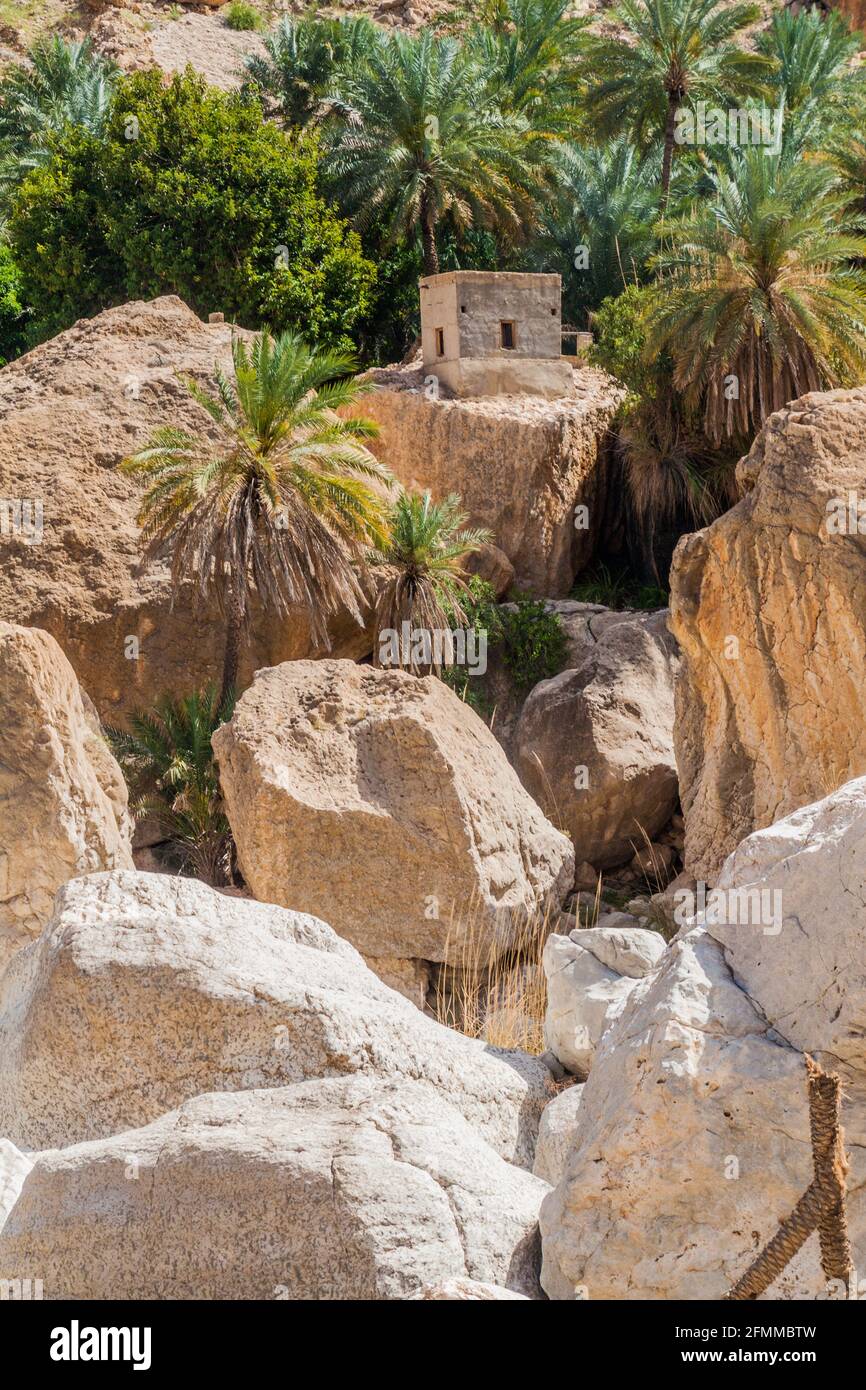 Small hut on a massive boulder in Wadi Tiwi valley, Oman Stock Photo ...
