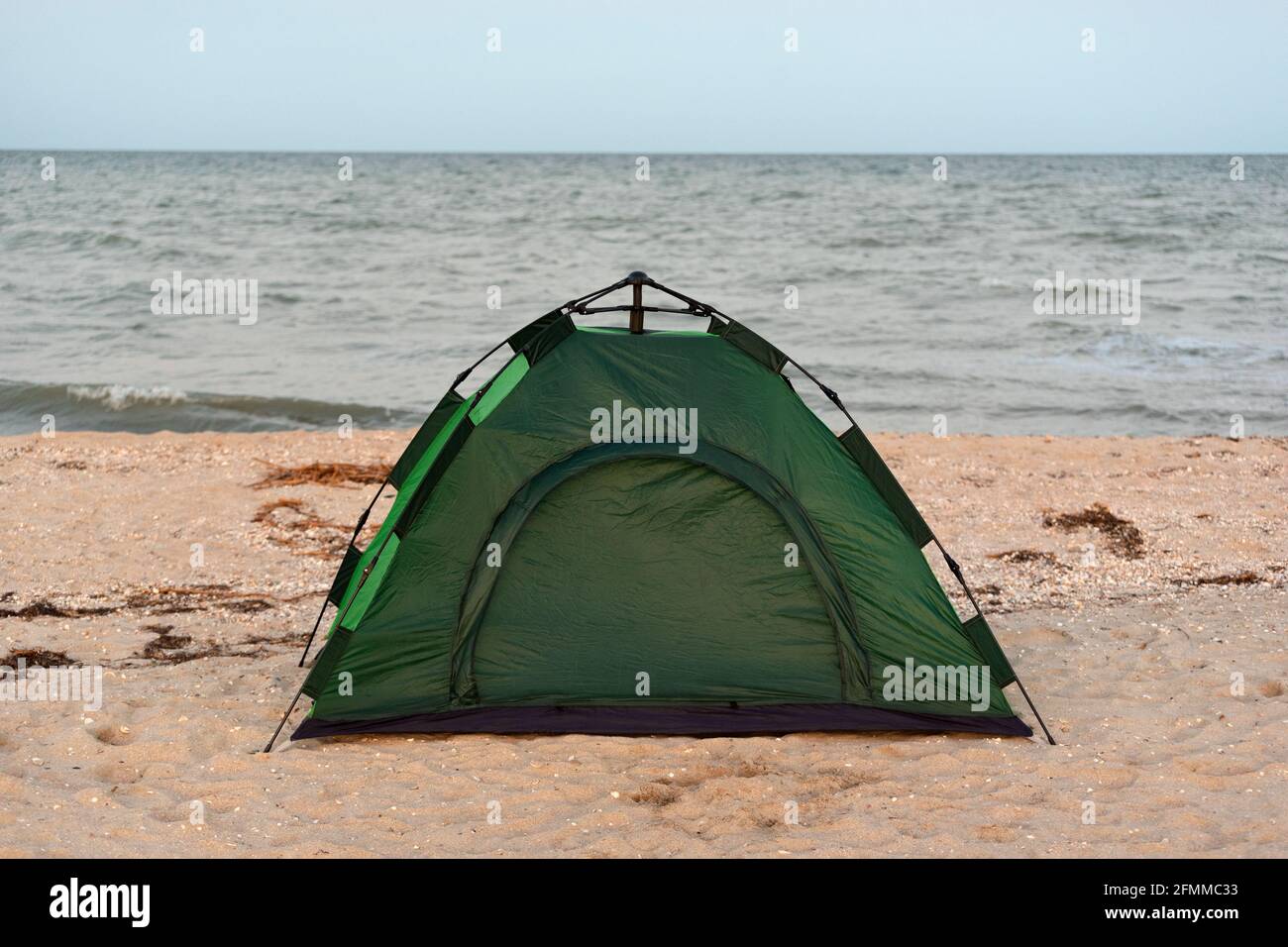 Tourist tent on the sandy beach. Camping by the sea Stock Photo - Alamy