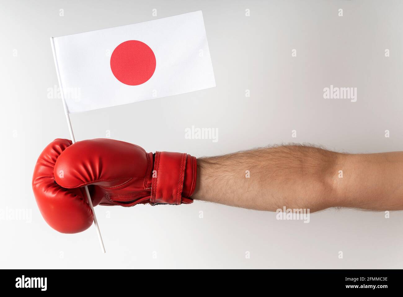 Boxing glove with Japanese flag. Boxer holds flag of Japan. White ...