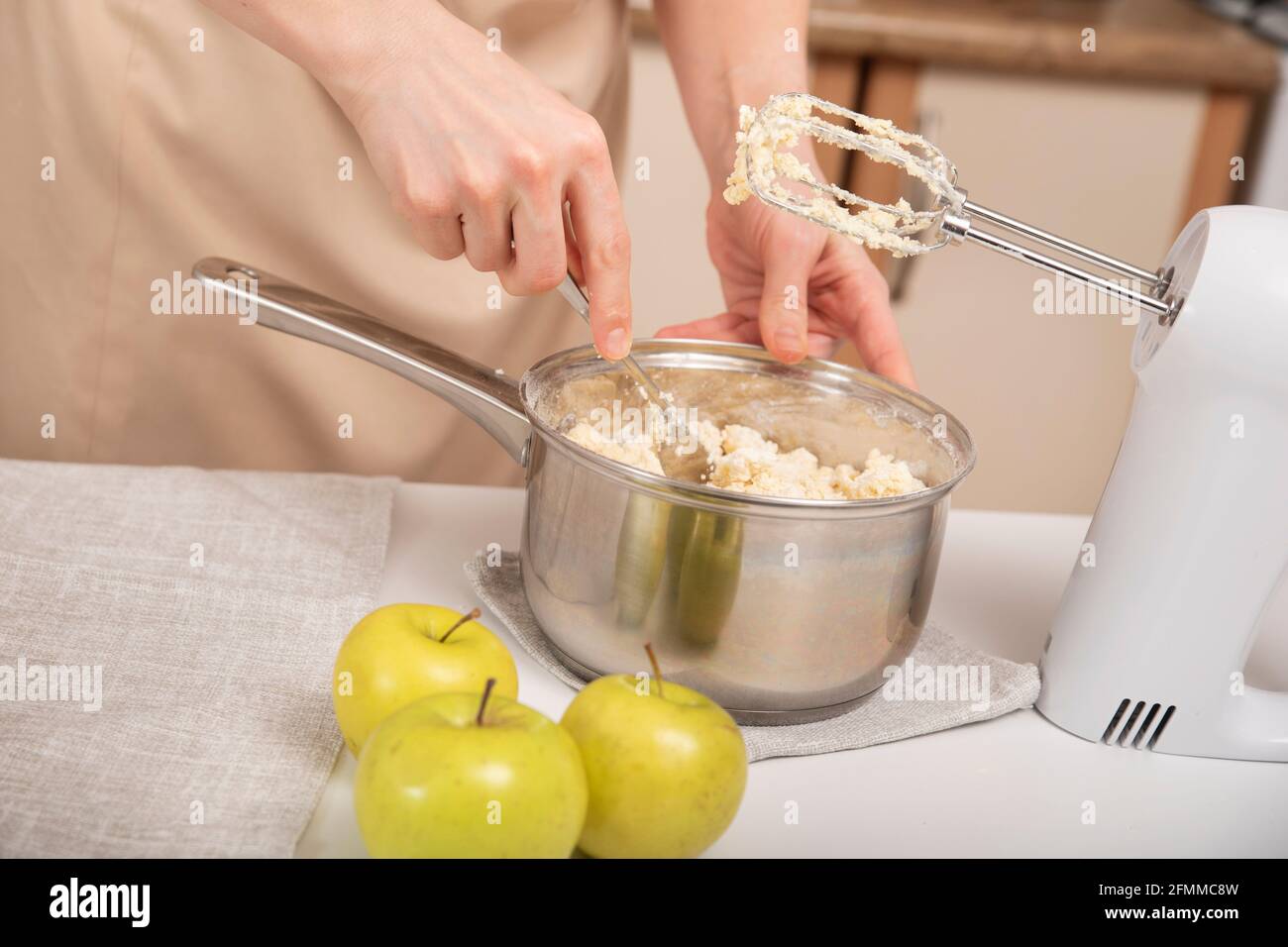 Cook prepares dough for apple pie. Process of making strudel Stock ...