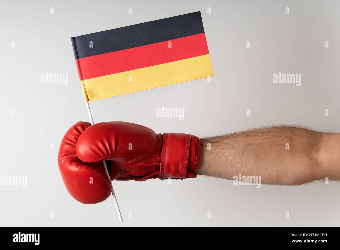 Boxing glove with Germany flag. Boxer holds flag of Germany. White ...