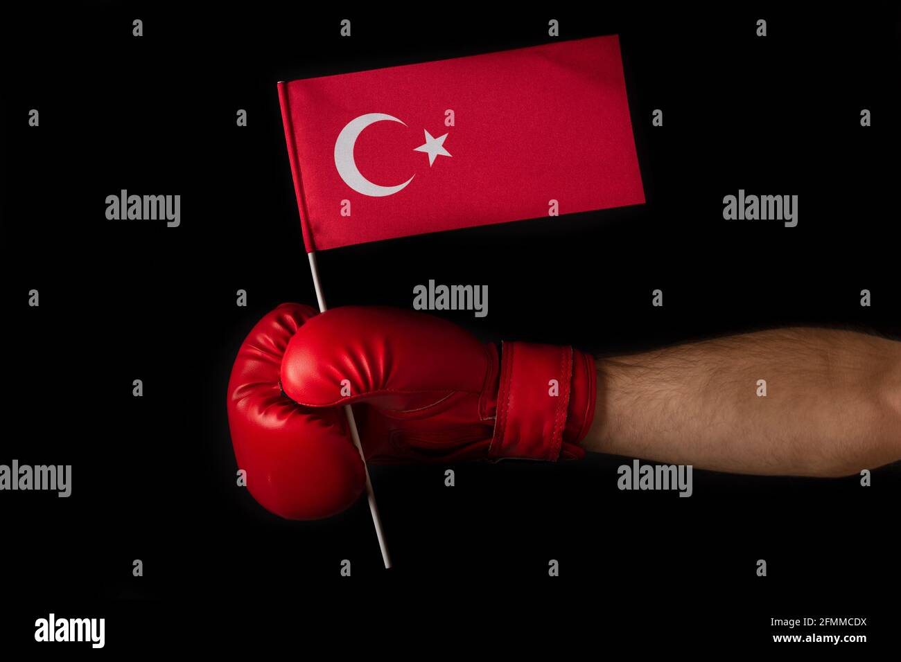 Boxer holding Turkey flag on black background Stock Photo - Alamy