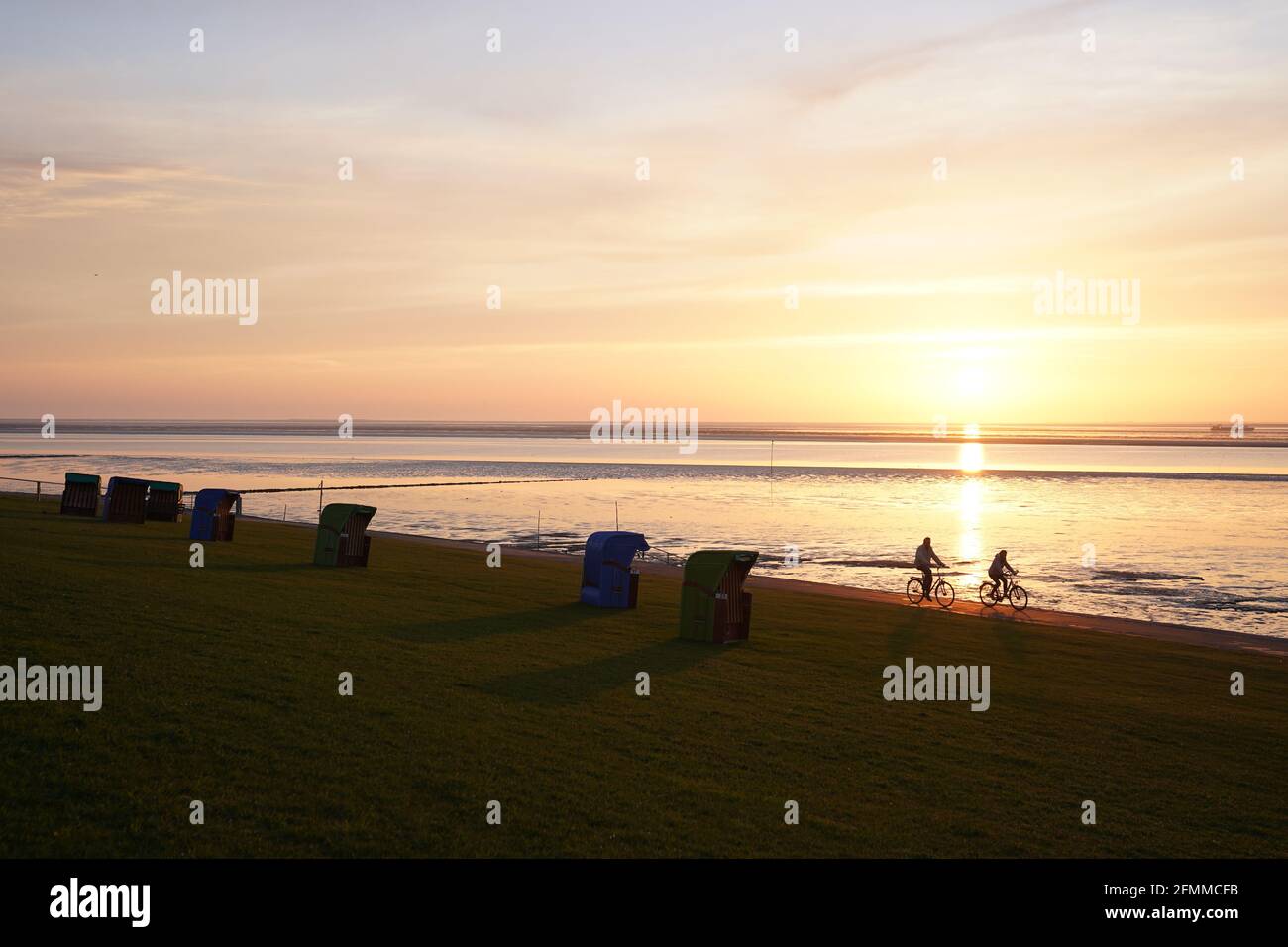 Pellworm, Germany. 10th May, 2021. The sun sets over the North Sea off ...