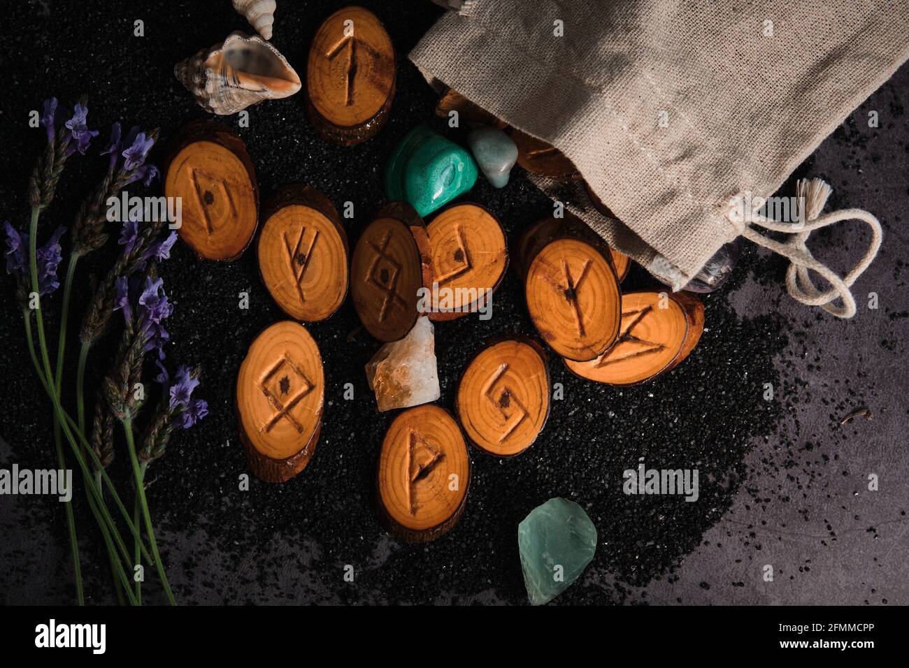 homemade wooden runes on a dark background Stock Photo - Alamy