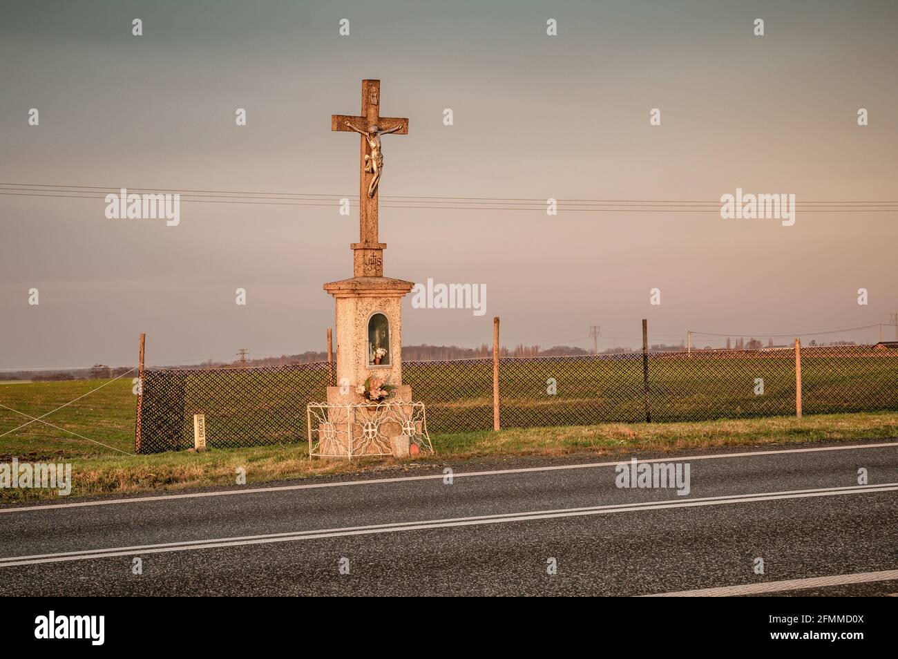 Large cross sculpture on the side of a road Stock Photo - Alamy