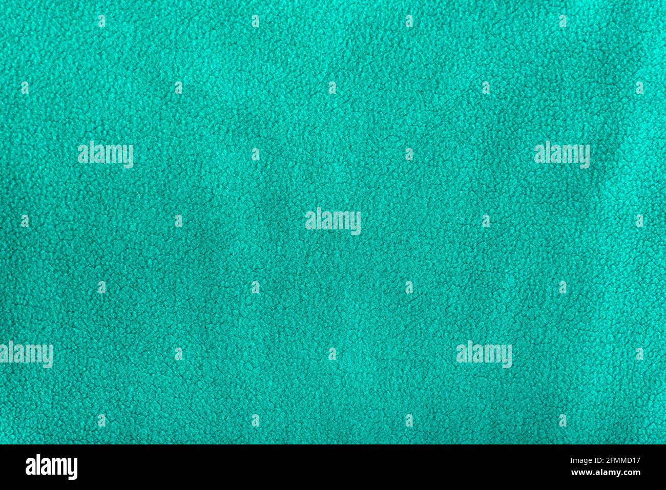 Green homogeneous fleece background. Textile surface. Cloth Stock Photo ...