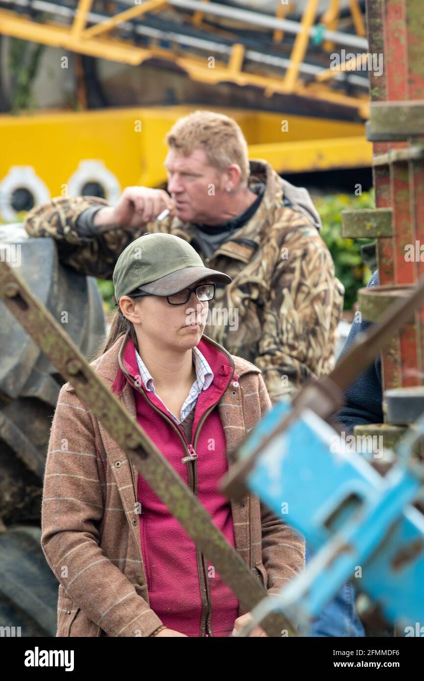 Two separate people at a Suffolk farm machinery auction Stock Photo - Alamy