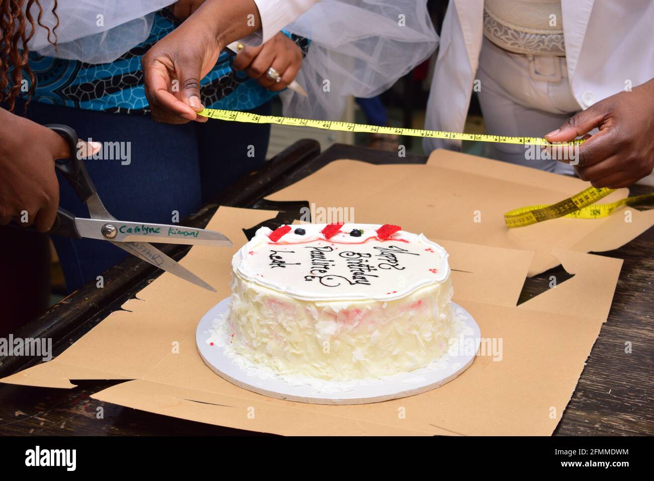 birthday cake measured with a measuring tape Stock Photo - Alamy