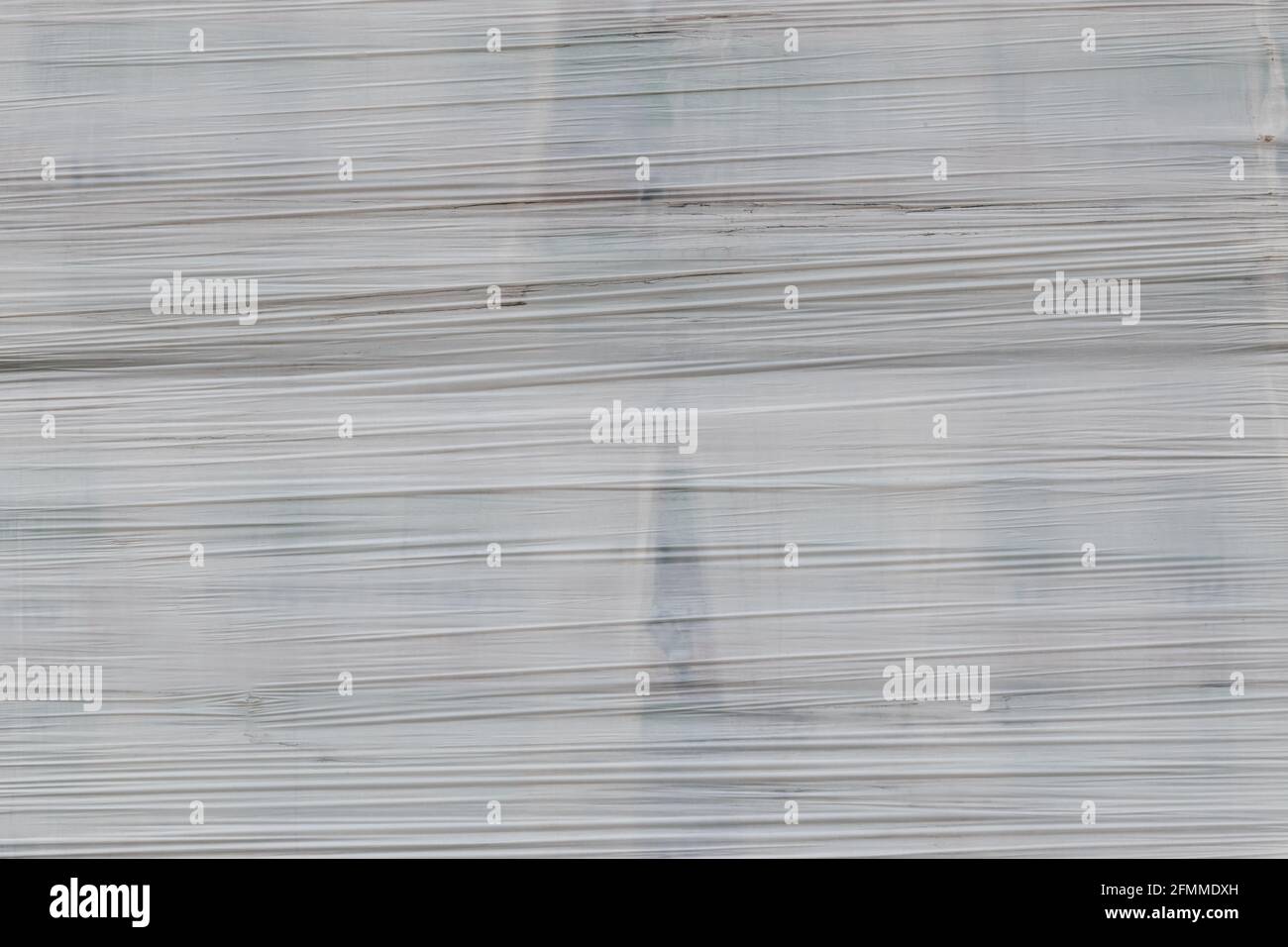 white shrink wrap film with horizontal folds - full frame background ...