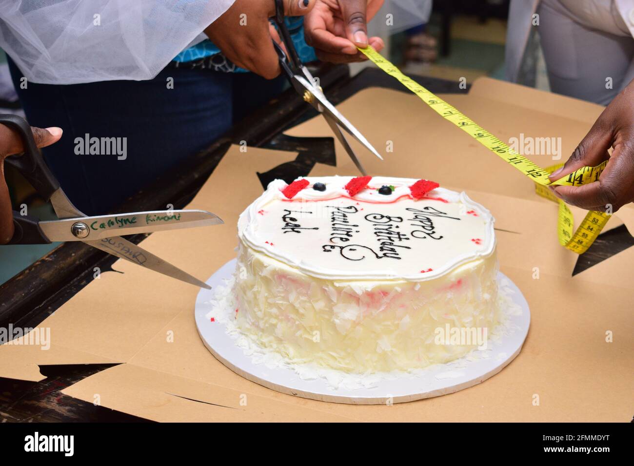 birthday cake measured with a measuring tape Stock Photo - Alamy