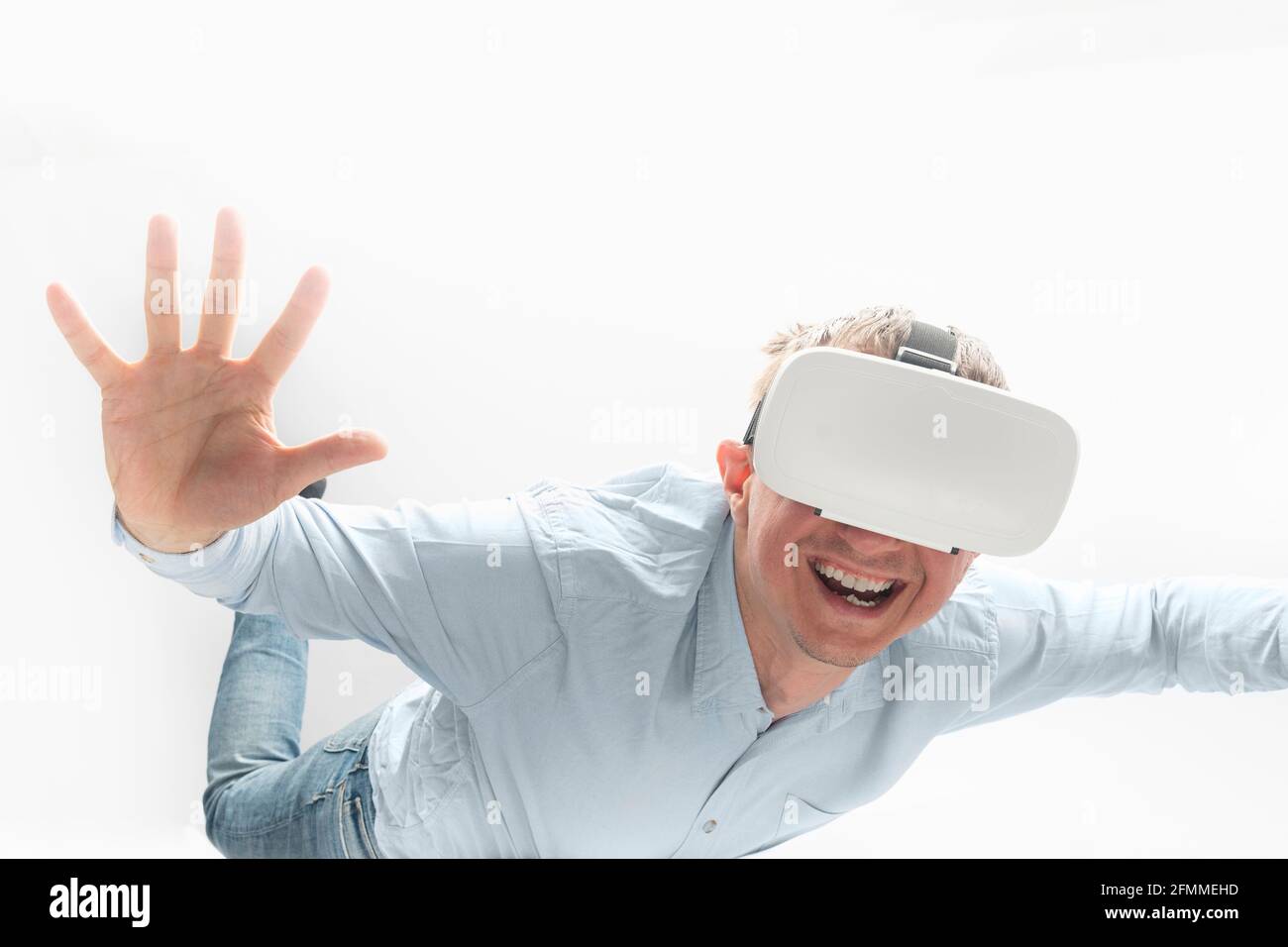 Man in virtual reality glasses is flying. Illusion of flight. VR games ...