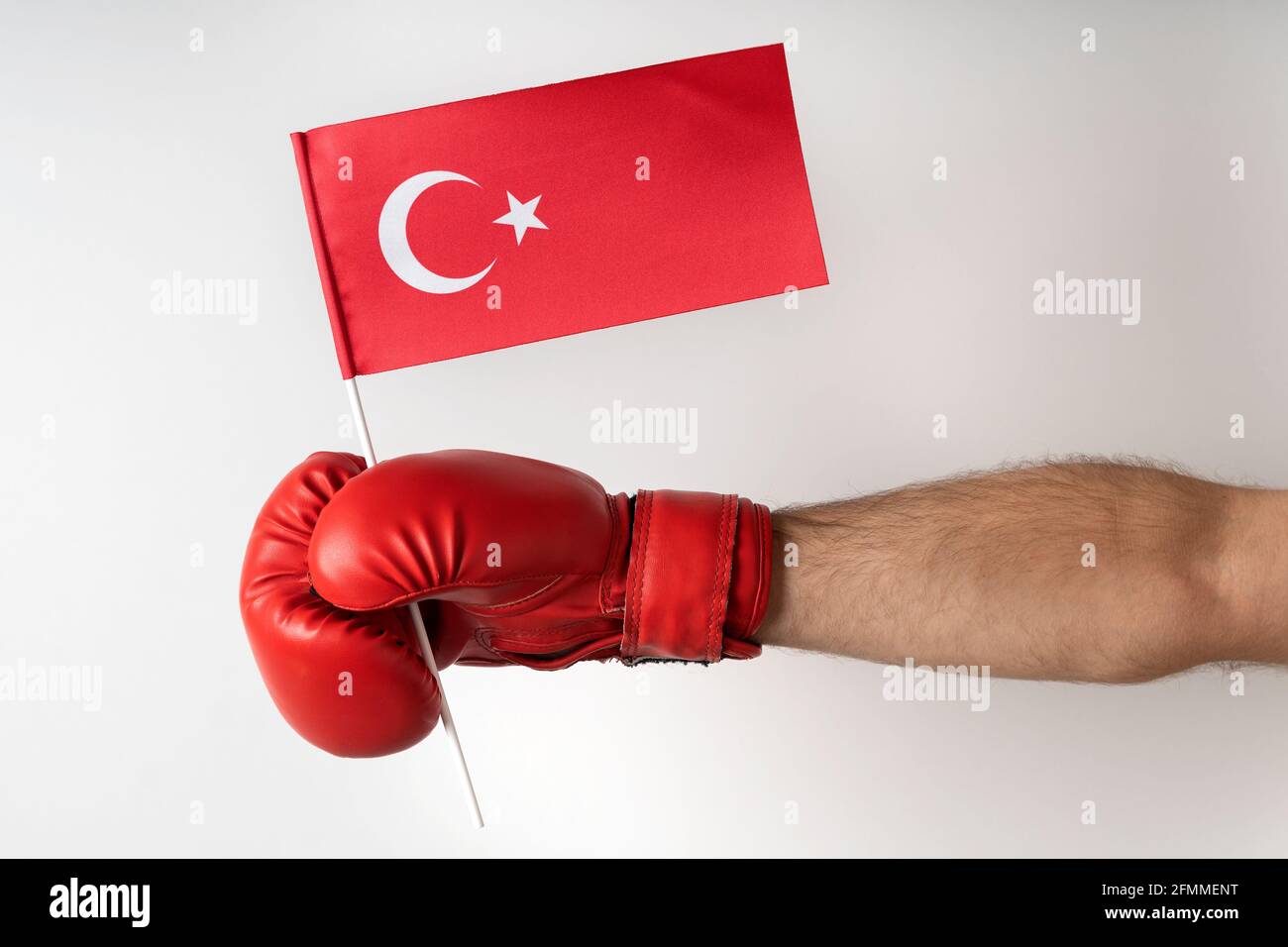 Boxing glove with Turkish flag. Boxer holds flag of Turkey. White ...