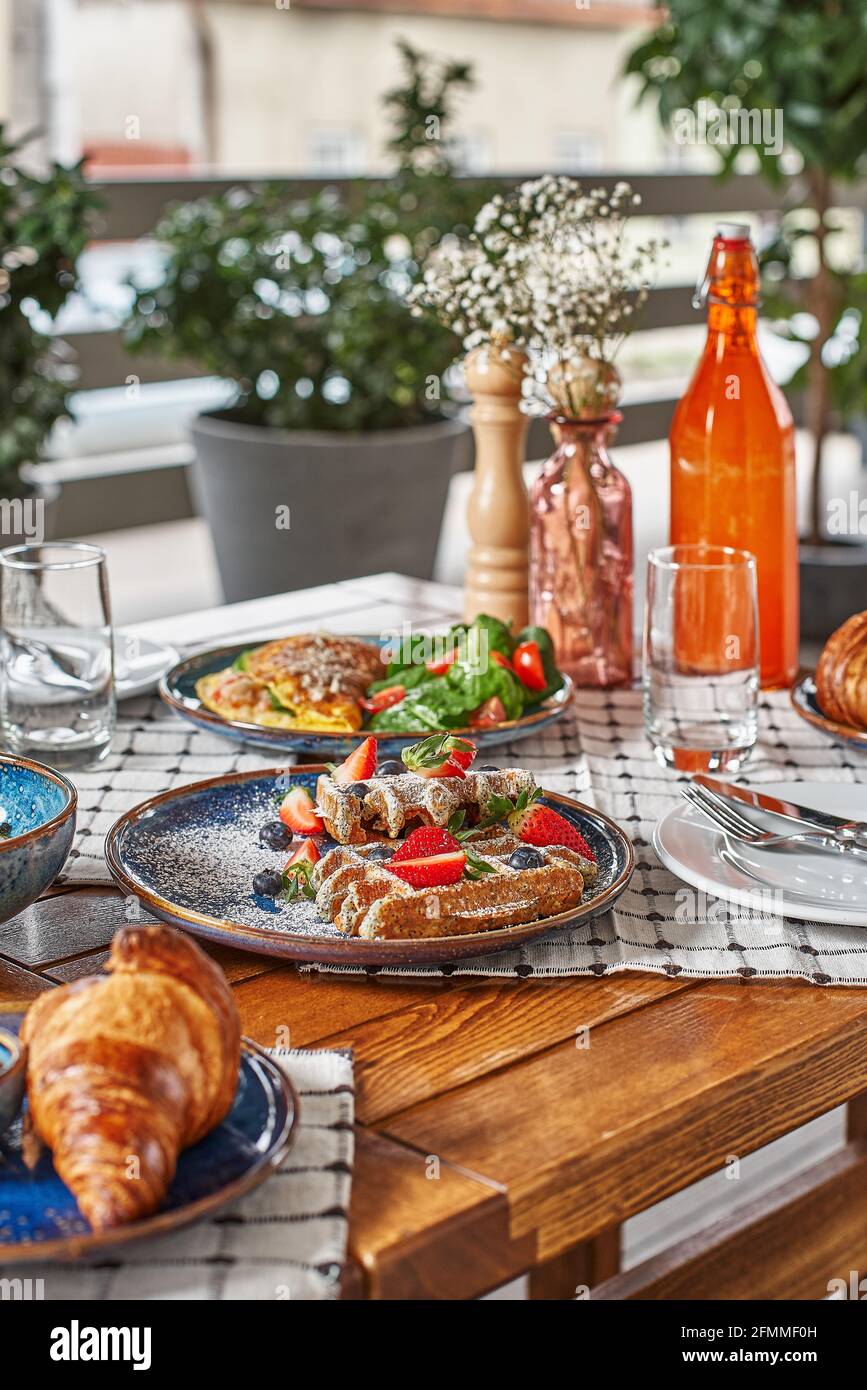 Traditional Belgian dessert Served table at summer terrace cafe ...