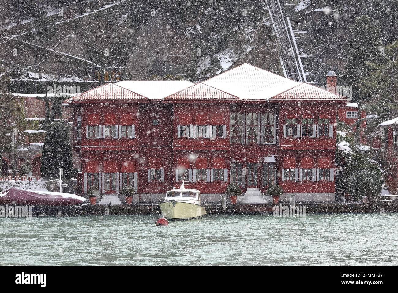 Old mansions (yali) are architectural symbols of Bosphorus, on a snowy ...