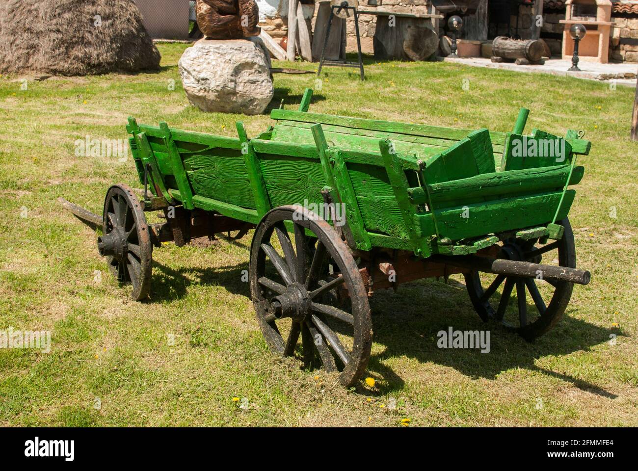 Old green wooden rural cart closeup in village house garden Stock Photo ...