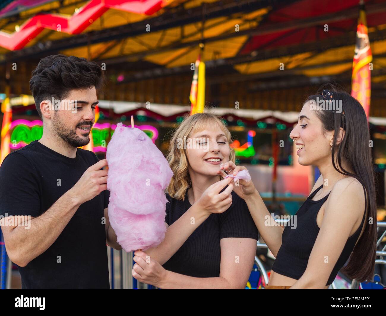 Girls eating candy cotton hi-res stock photography and images - Alamy