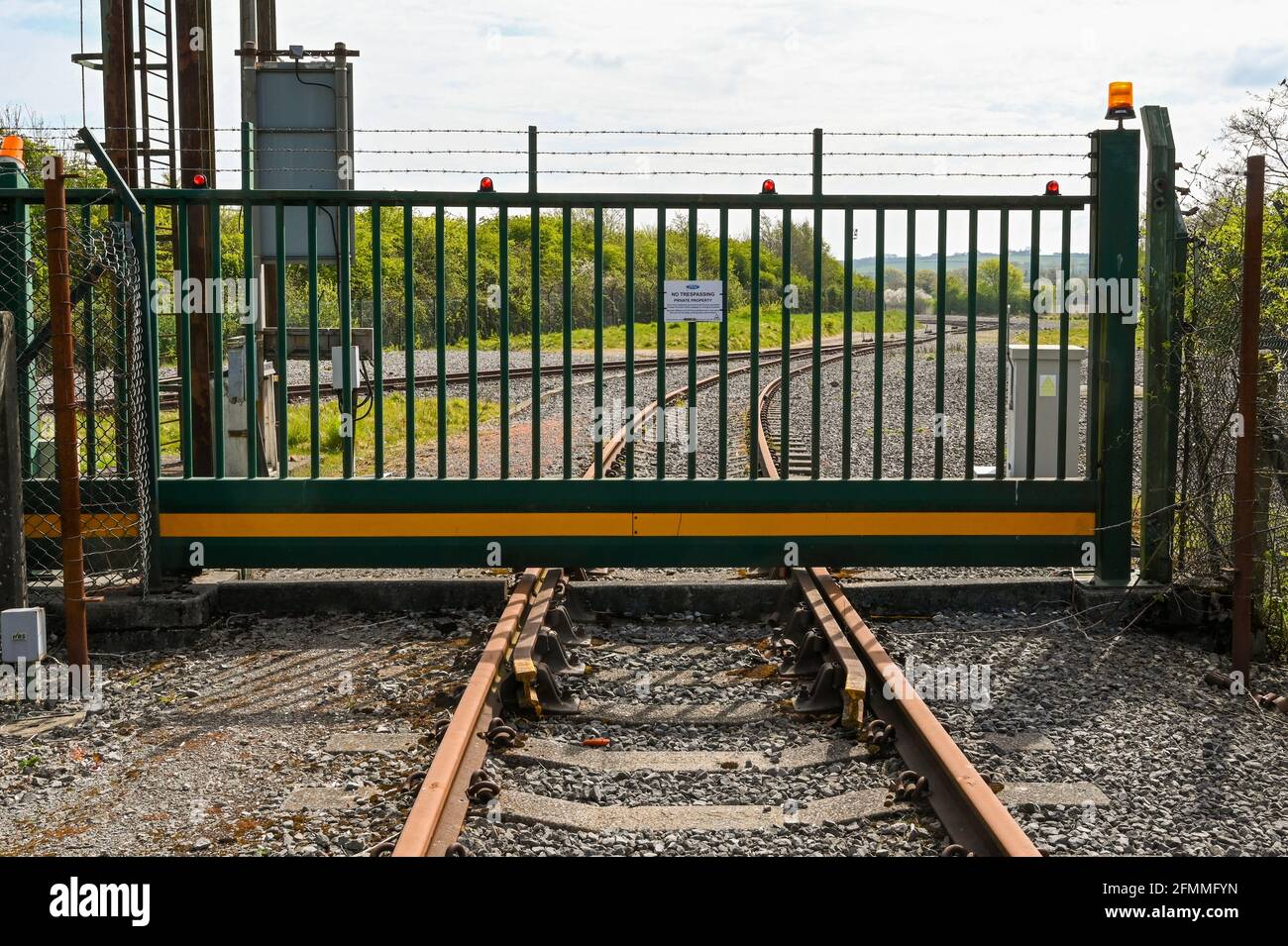 Bridgend, Wales - April 2021: Heavy steel gate across the railway line ...
