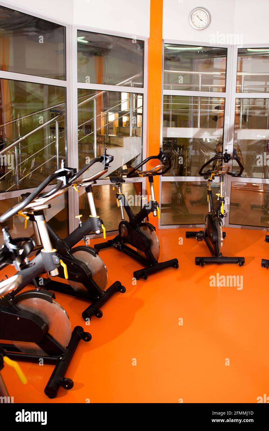 Rows of stationary bike in gym modern fitness center Stock Photo - Alamy