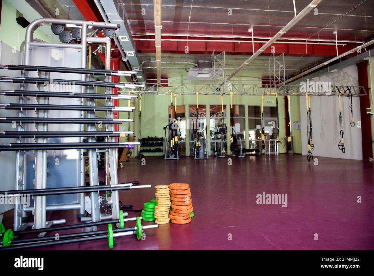 Gym interior with equipment, dumbbells on a rack Stock Photo - Alamy