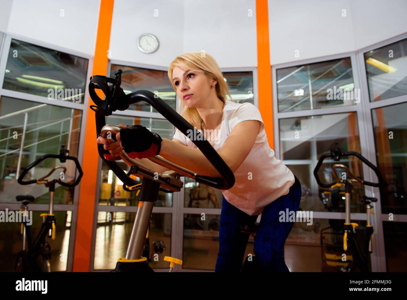 Cardio workout in gym by beautiful female Stock Photo - Alamy