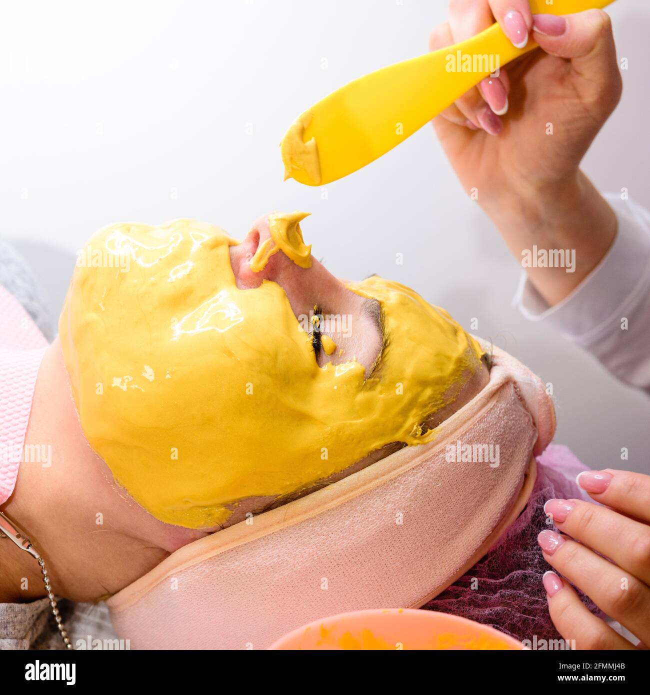 Golden mask on a woman's face, aromatic mask for relaxation and skin ...