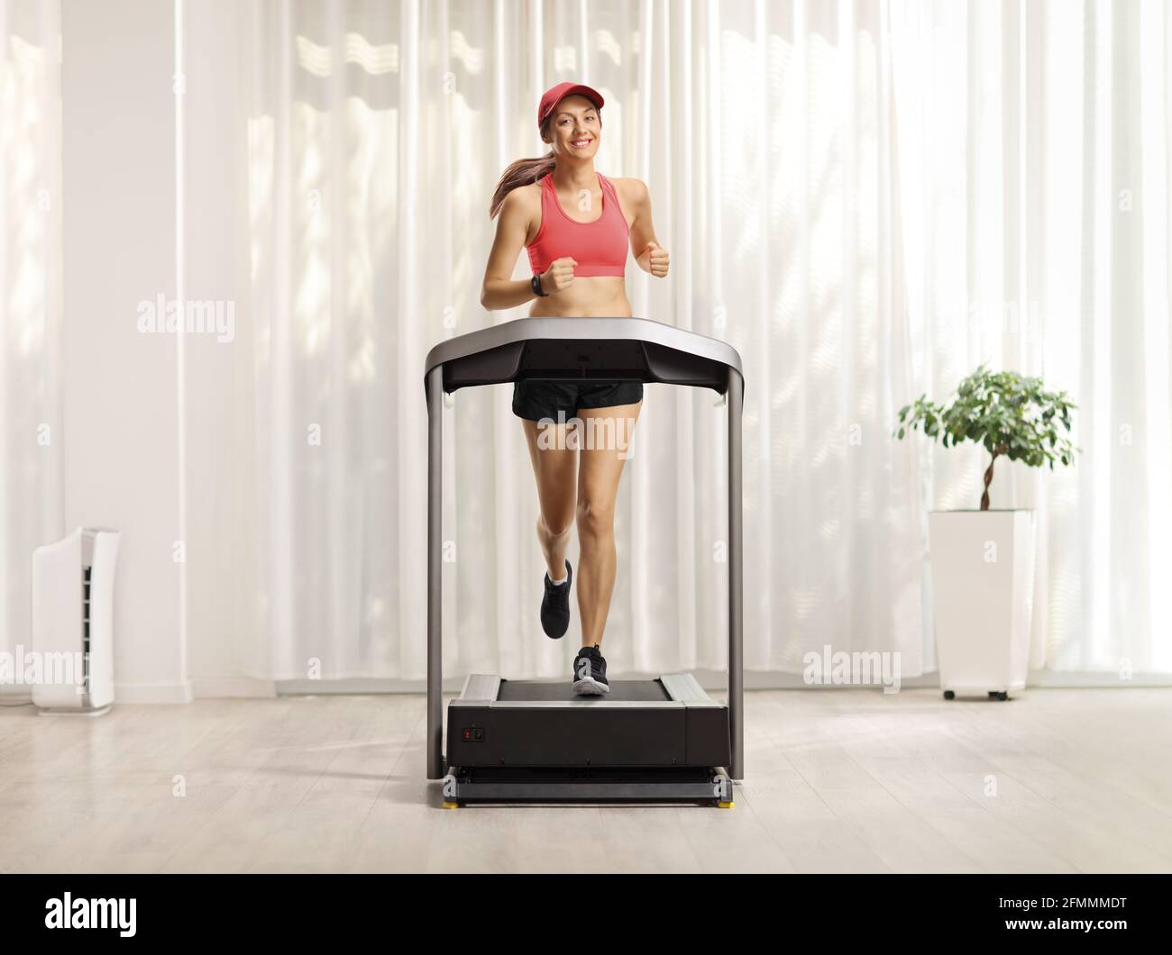 Young attractive female treadmill runner hi-res stock photography and ...