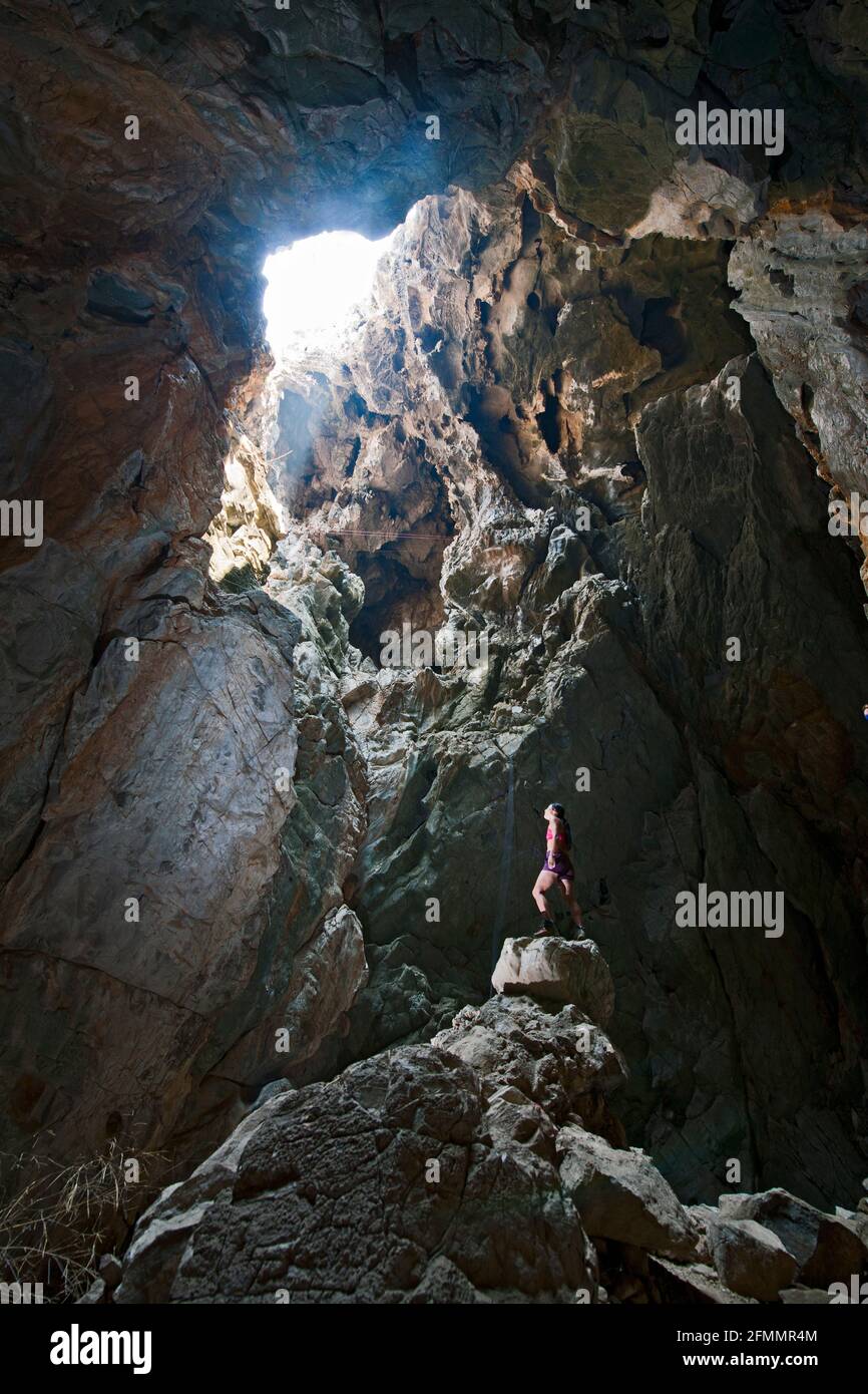 exploring the Anxiety state crisis cave at Crazy Horse buttress Stock ...