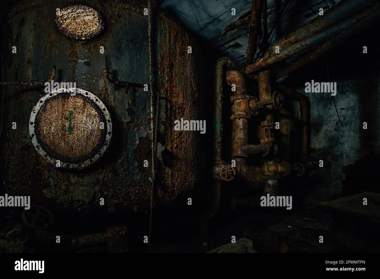 Old rusty vat and pipes in underground basement Stock Photo - Alamy