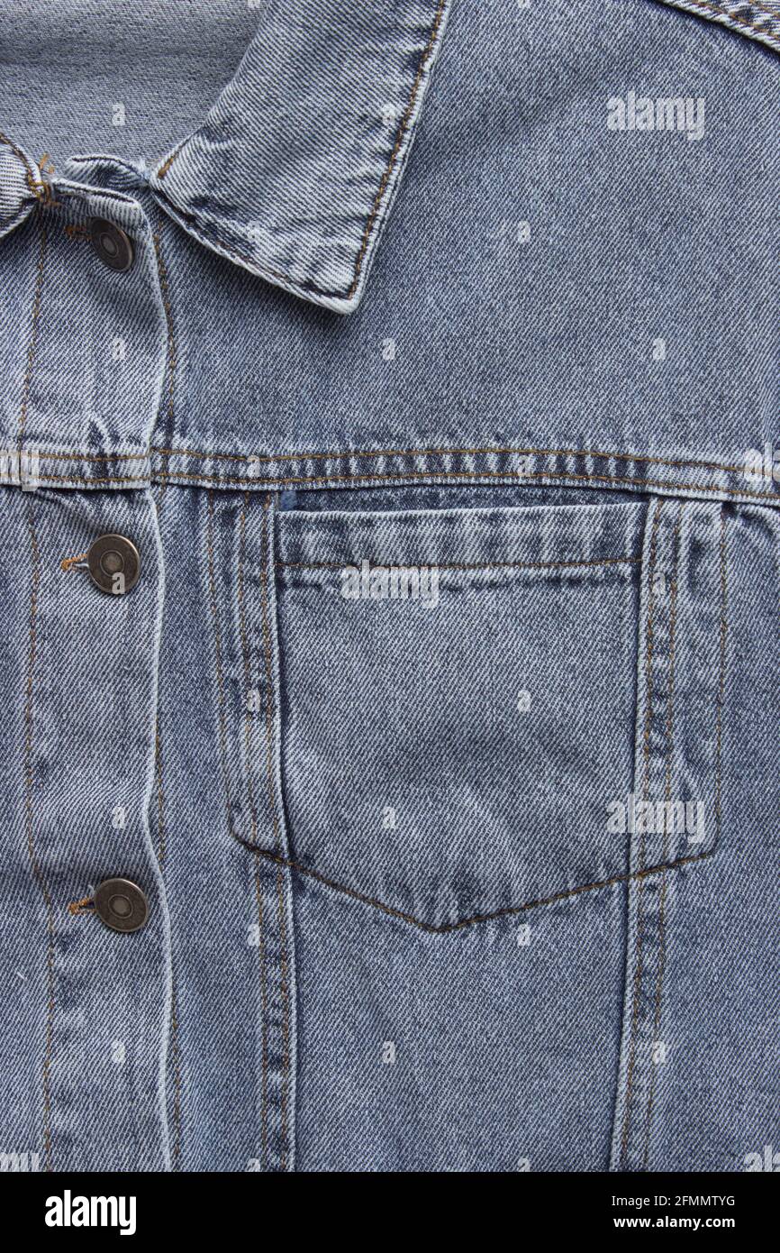 Close up of the front of a denim jacket. Close-up denim jacket pocket ...