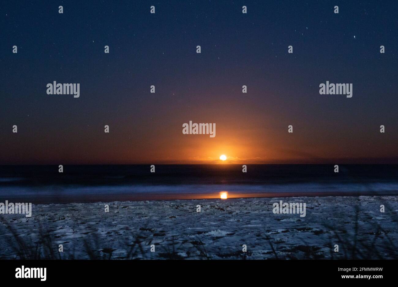 Sunrise/Moonrise Over the Ocean on the Gold Coast Stock Photo - Alamy