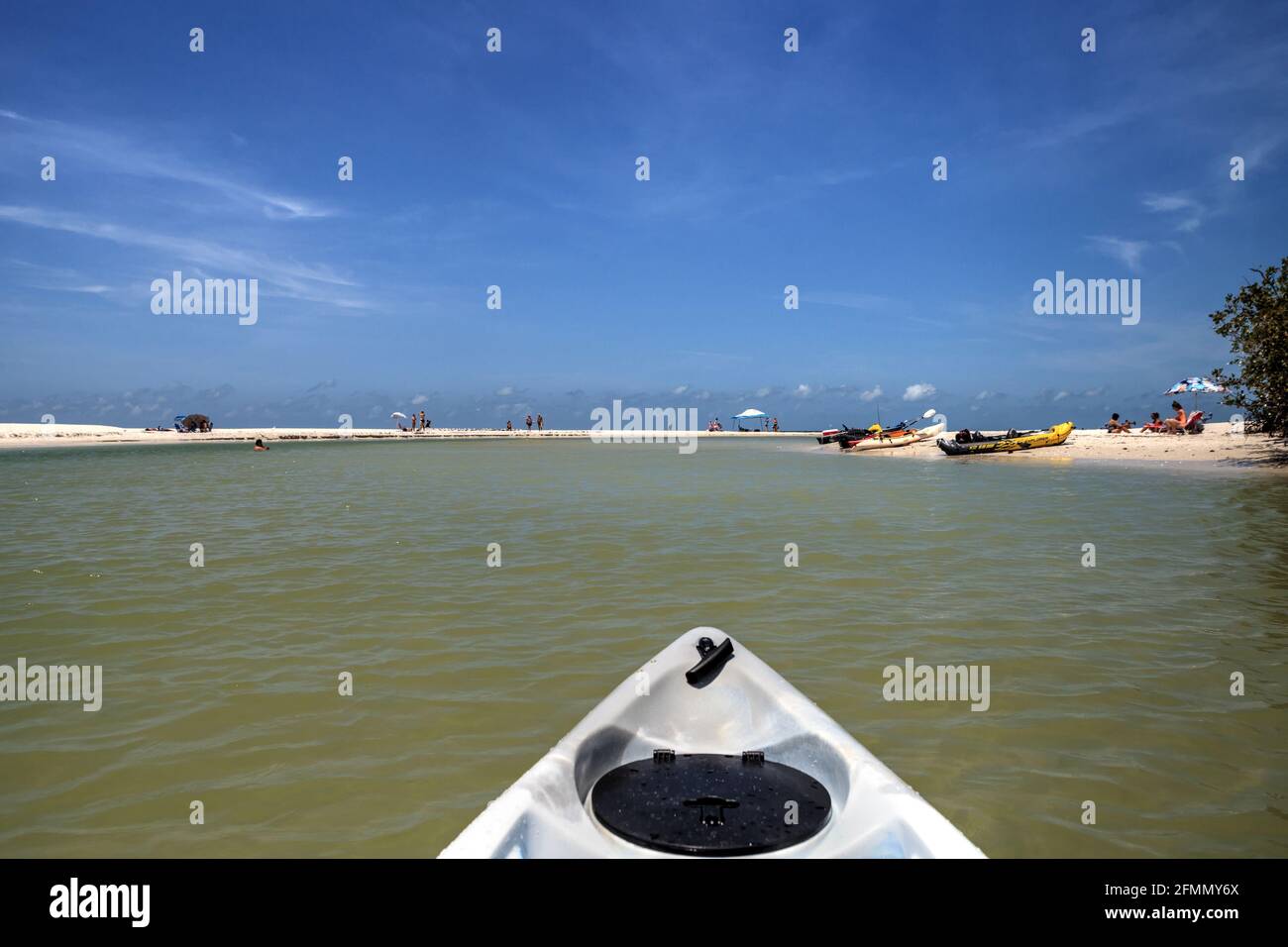 Blue sky over the entrance to the ocean of Clam Pass from a kayak in ...