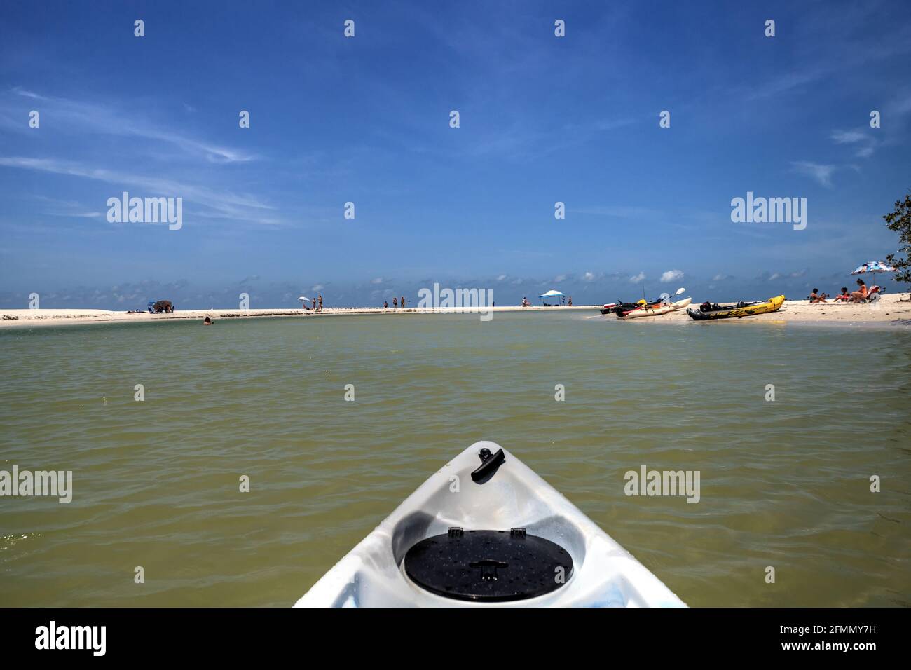 Blue sky over the entrance to the ocean of Clam Pass from a kayak in ...