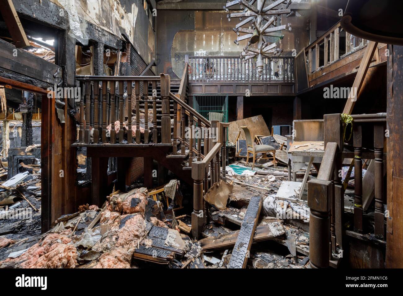 What remains of the fire damaged lobby and chandelier of an abandoned ...