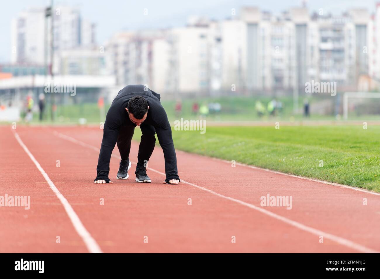 Sprinter Man Running on Red Tracks Lanes in Track and Field Stadium ...