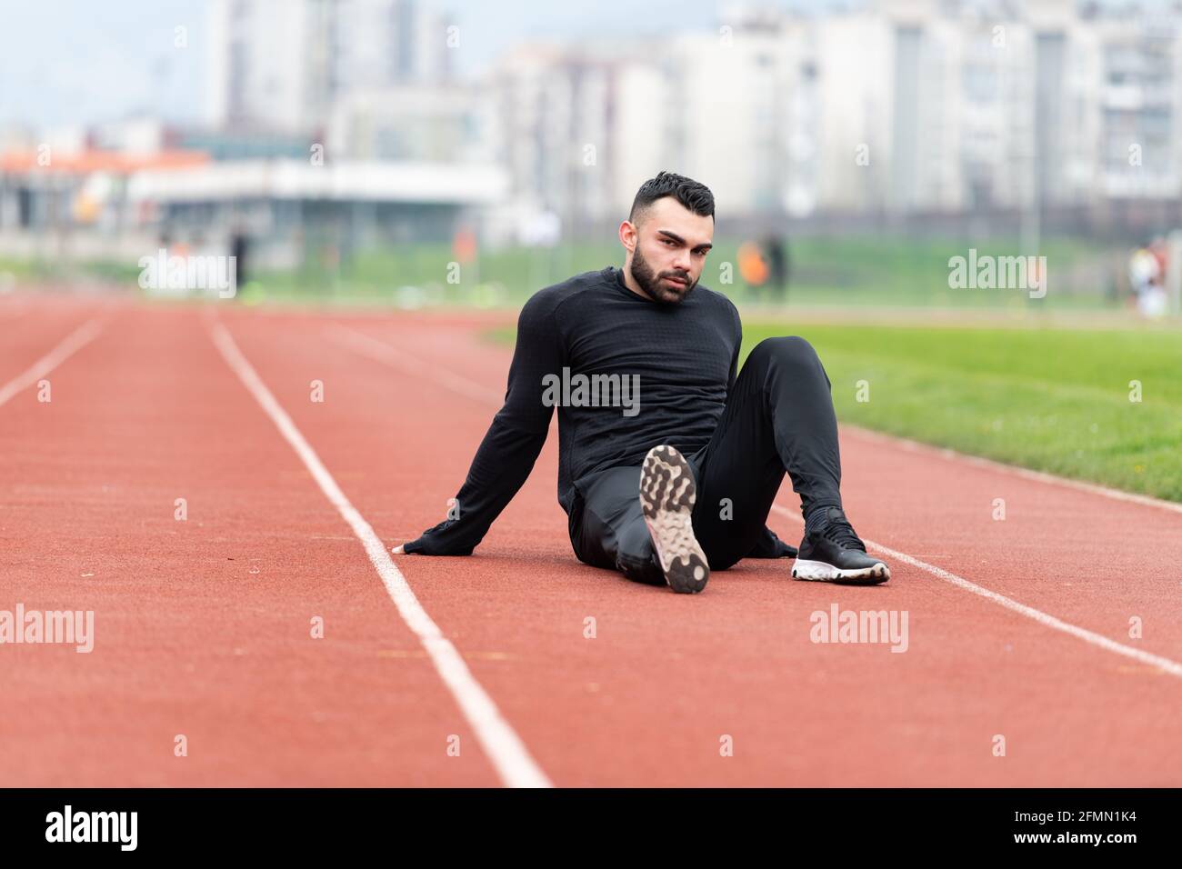 Man Stretching Legs Breaking Relax After Running Tired - Rest Training ...