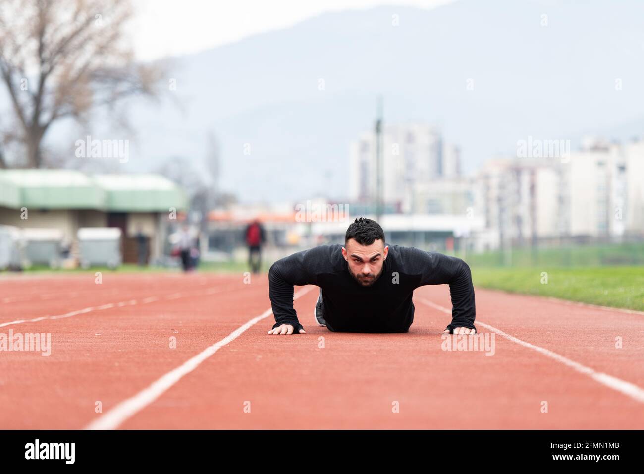 Handsome male runner doing push ups hi-res stock photography and images ...