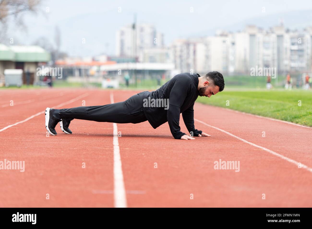 Handsome male runner doing push ups hi-res stock photography and images ...