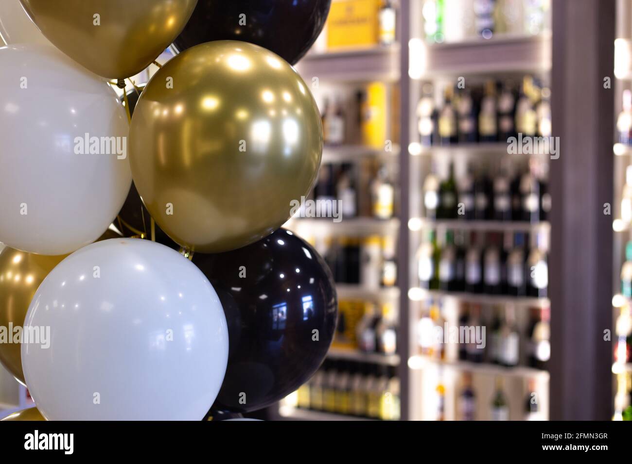 Champagne bottle balloons hi-res stock photography and images - Alamy