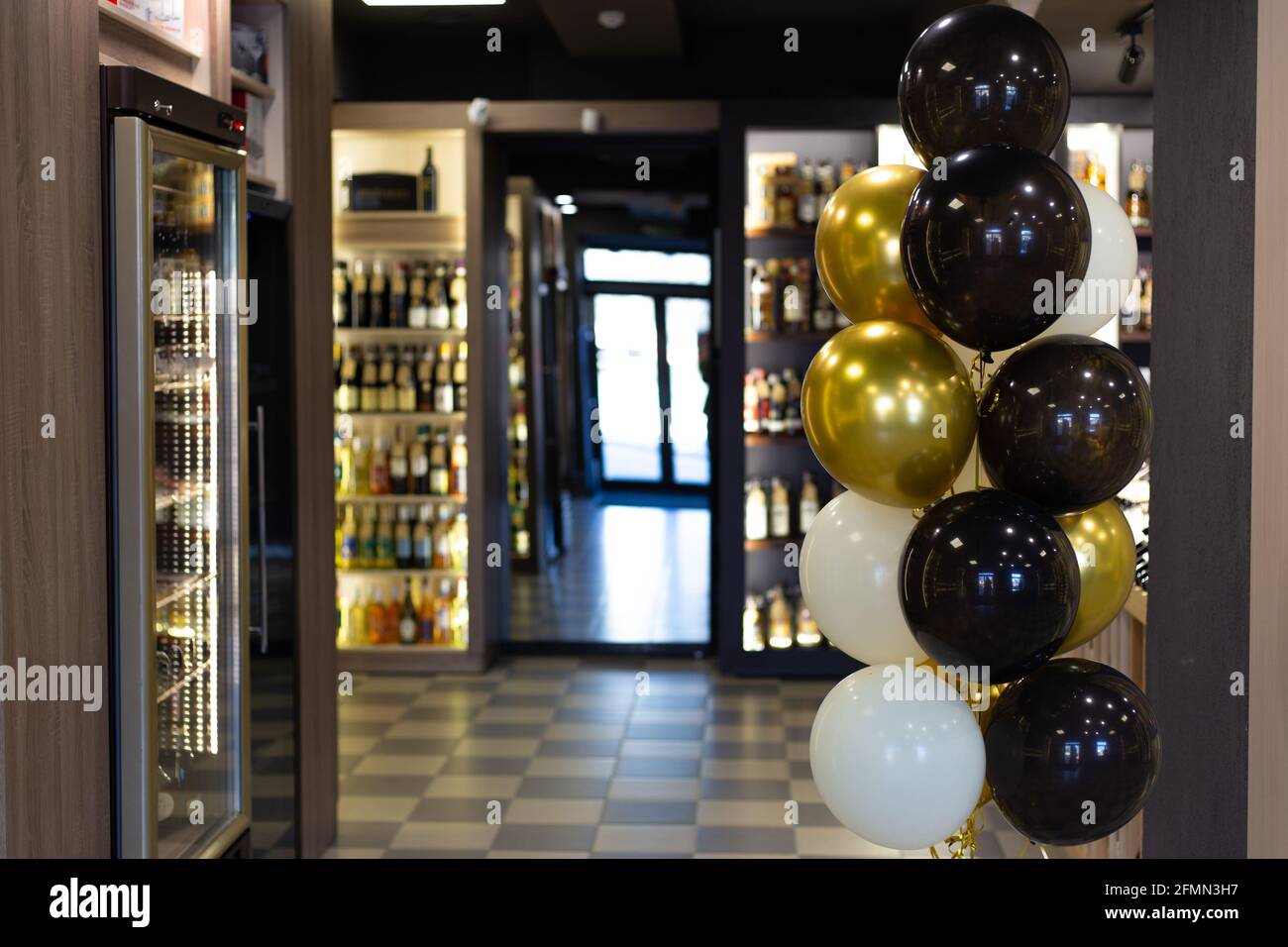 The alcohol store is decorated with balloons on the occasion of the ...