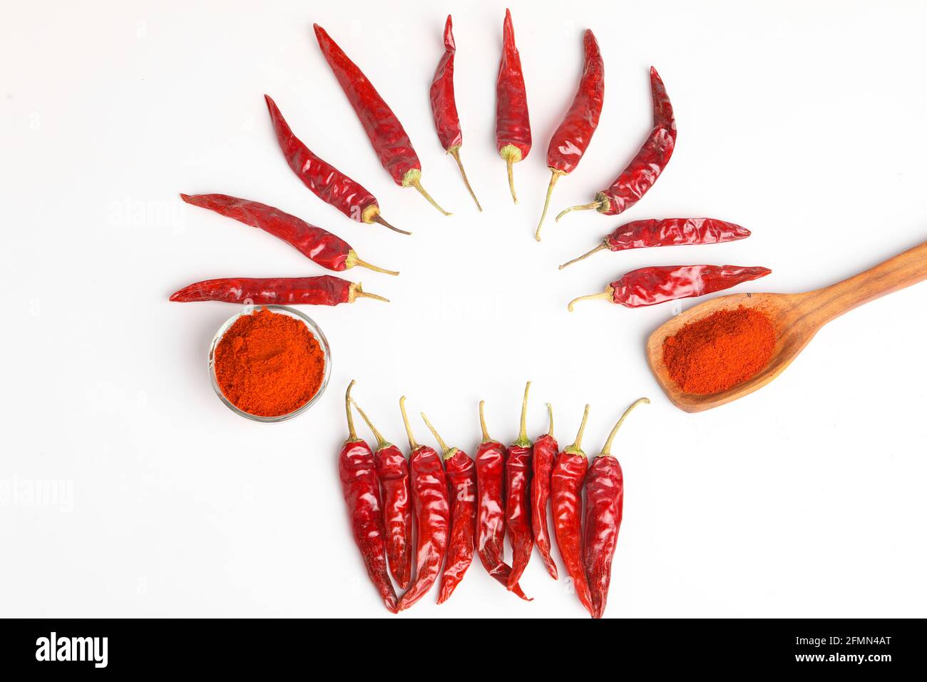 Dried red chilli and powder in glass bowl on white background Stock ...