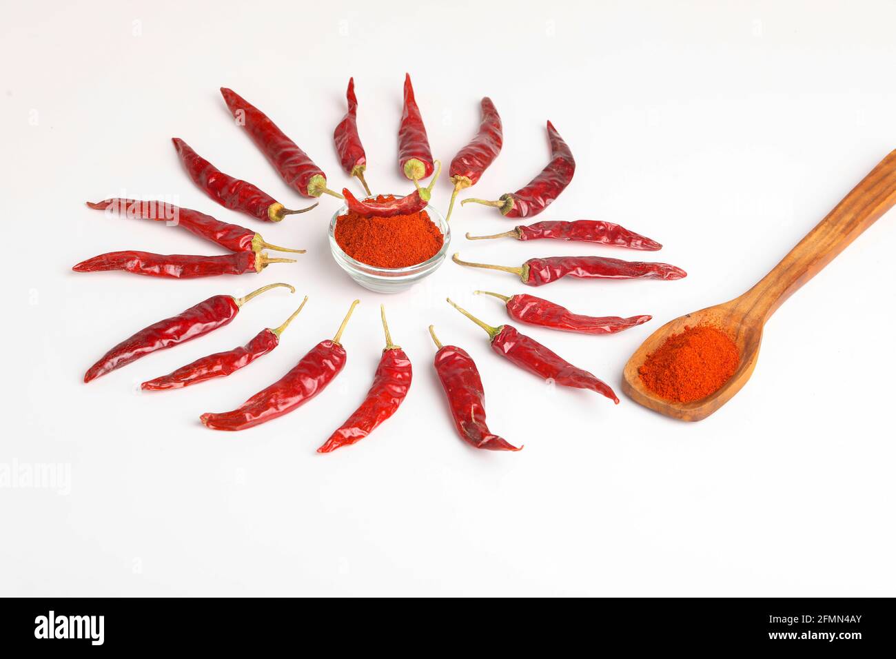 Dried red chilli and powder in glass bowl on white background Stock ...