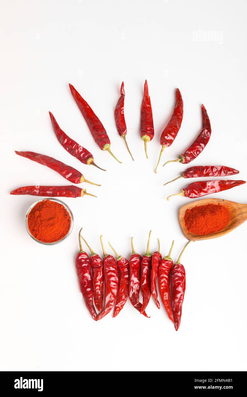 Dried red chilli and powder in glass bowl on white background Stock ...