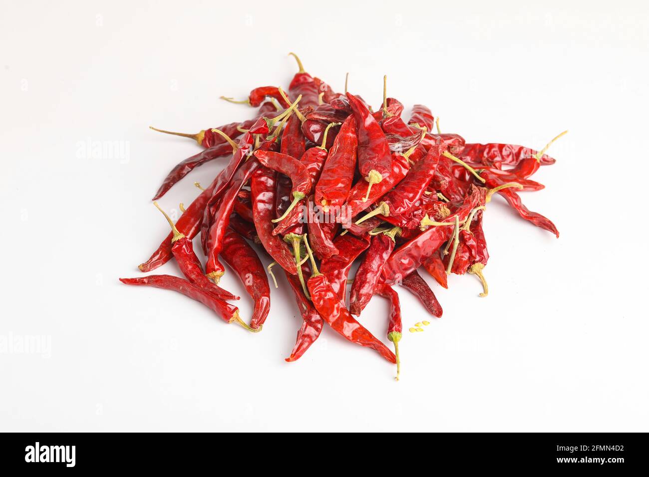 Dried red chilli on white background Stock Photo - Alamy