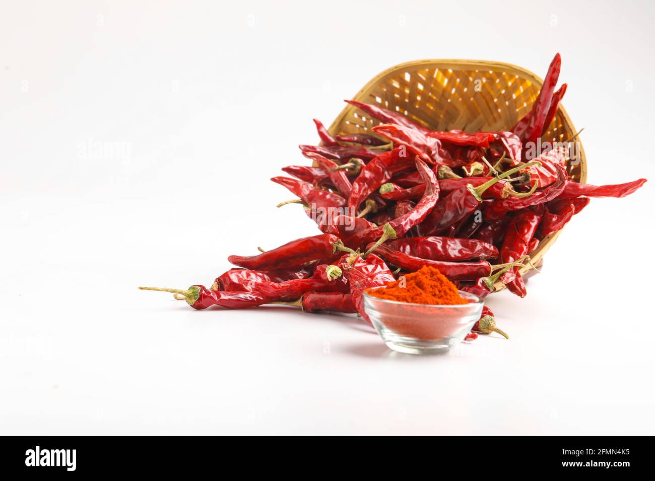 Dried red chilli wooden bowl on white background Stock Photo - Alamy