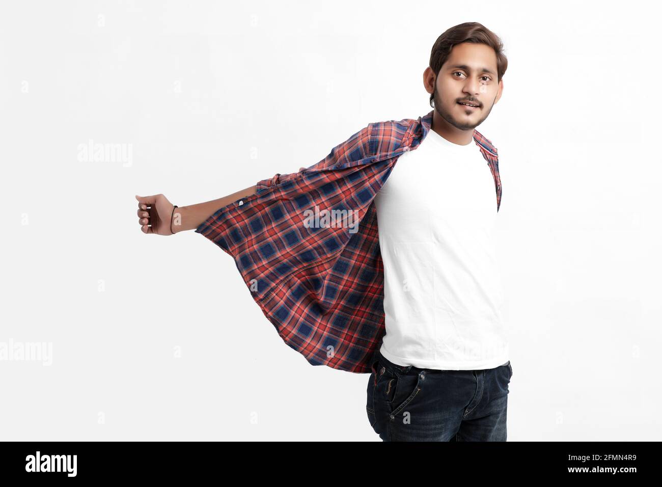 Indian or Asian man giving multi pal expression over white background ...